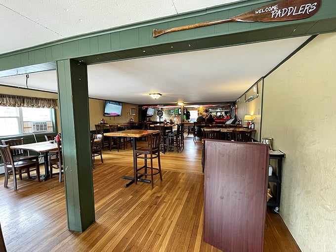 Welcome Paddlers announces the entryway to this warm, wood-floored haven where outdoor adventures end and culinary ones begin.