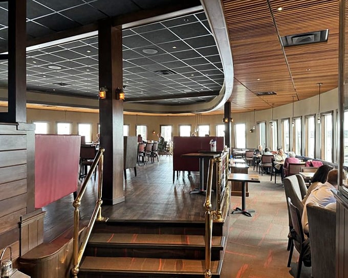 Step inside to a dining room where curved wood ceilings and panoramic windows create the perfect seafaring atmosphere.