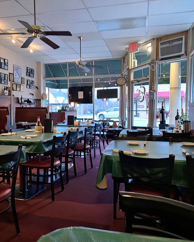 Inside, green tablecloths and ceiling fans create that classic neighborhood Italian joint vibe where comfort trumps trendiness every time.