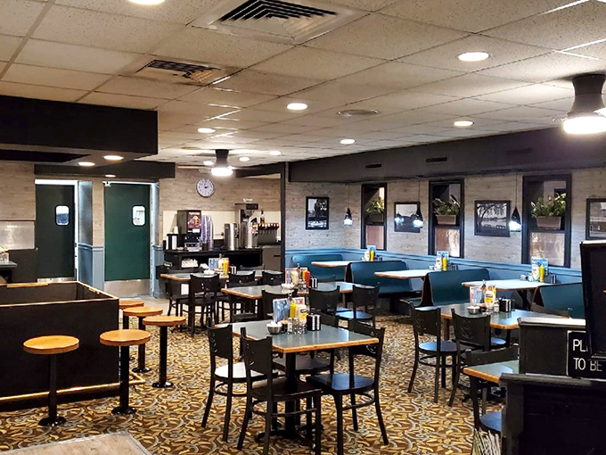 Inside, teal booths and patterned floors create that perfect diner atmosphere where conversations flow as freely as the coffee refills.