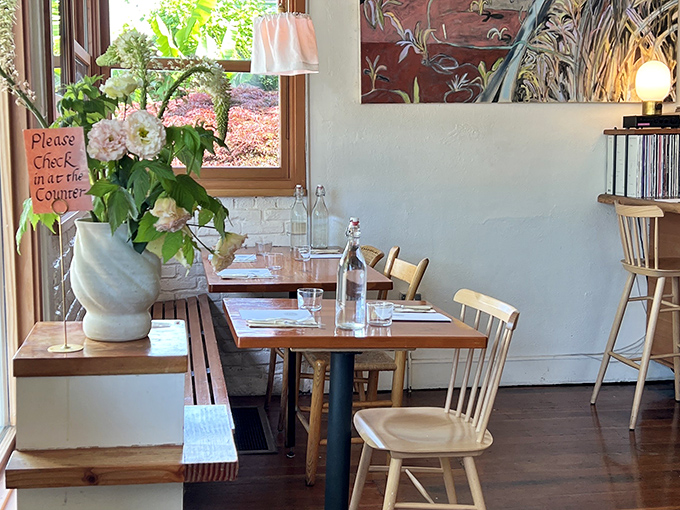 Fresh flowers, natural light, and wooden tables create that perfect "I've discovered somewhere special" feeling that makes Portland's dining scene so magical.