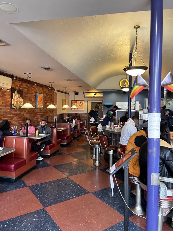 Classic diner aesthetics done right&mdash;checkerboard floors, red vinyl booths, and that counter where breakfast dreams come true. The sizzle soundtrack is complimentary.