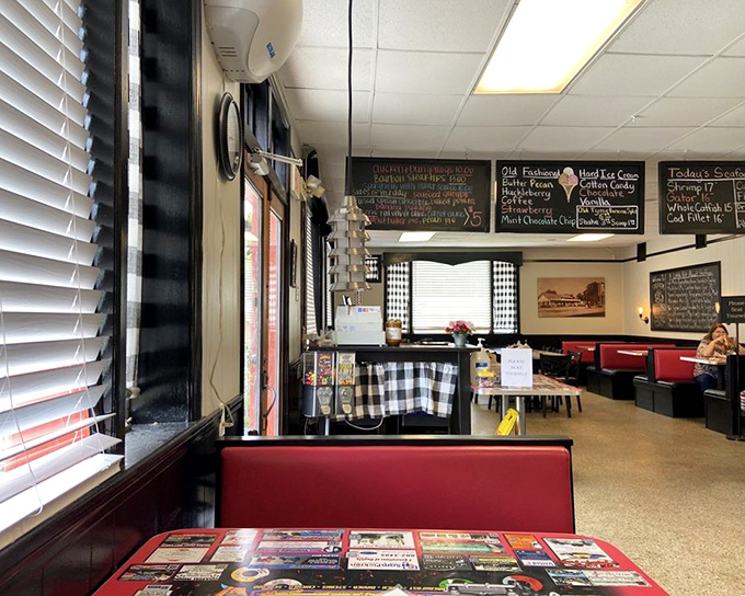 Classic diner aesthetics with those red vinyl booths and checkered accents&mdash;like stepping into a time machine where calories don't count.
