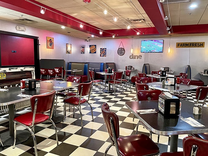 Classic black and white tiles meet cherry-red vinyl in diner heaven. This isn't just decoration&mdash;it's a time machine to when calories didn't count.