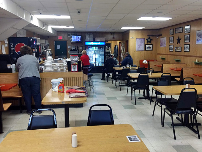 Inside, wood-paneled walls and no-nonsense seating create the perfect stage where comfort food takes the starring role.