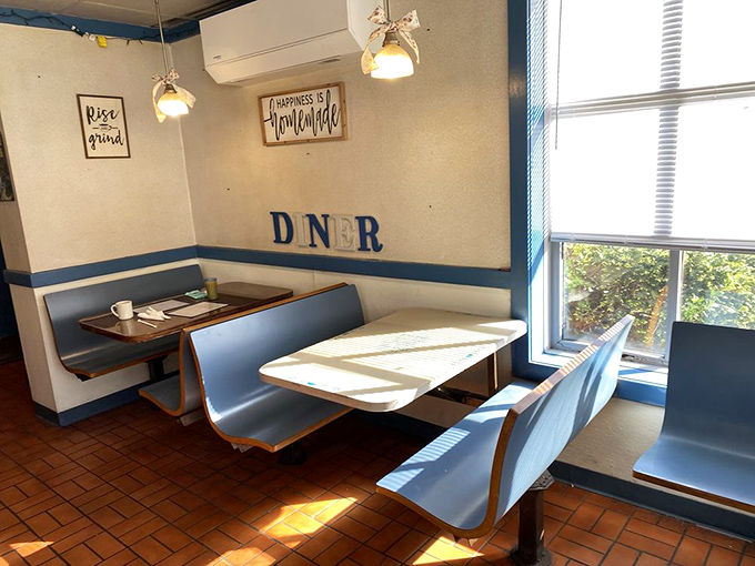 Sunlight dances across classic blue vinyl booths where countless conversations have unfolded over steaming coffee and perfect toast.