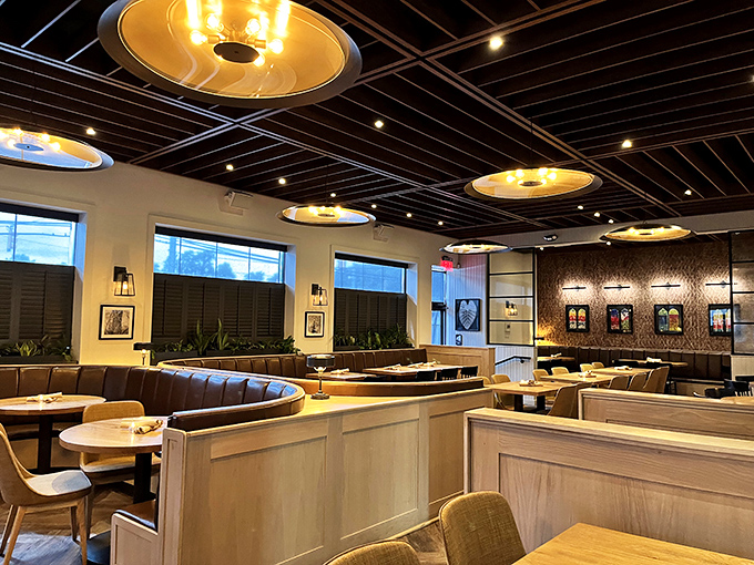 Golden pendant lights cast a warm glow over the dining room, creating that perfect "I'm-somewhere-special-but-still-comfortable" atmosphere that makes you want to linger.