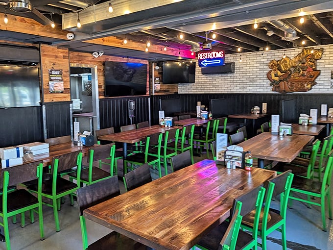 Industrial-chic meets comfort in this dining room where rustic wooden tables and electric green chairs create the perfect backdrop for carb-loading adventures.