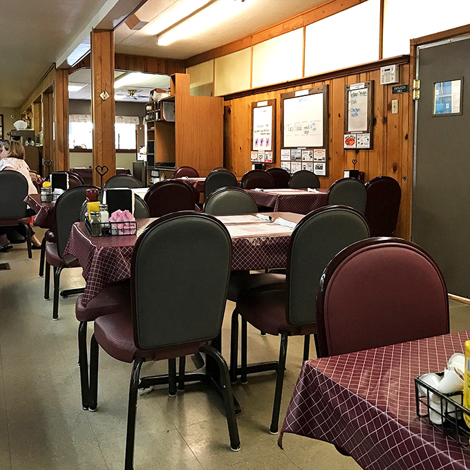 Classic checkered tablecloths and comfortable seating create that "grandma's dining room" vibe where conversations flow as freely as the coffee.