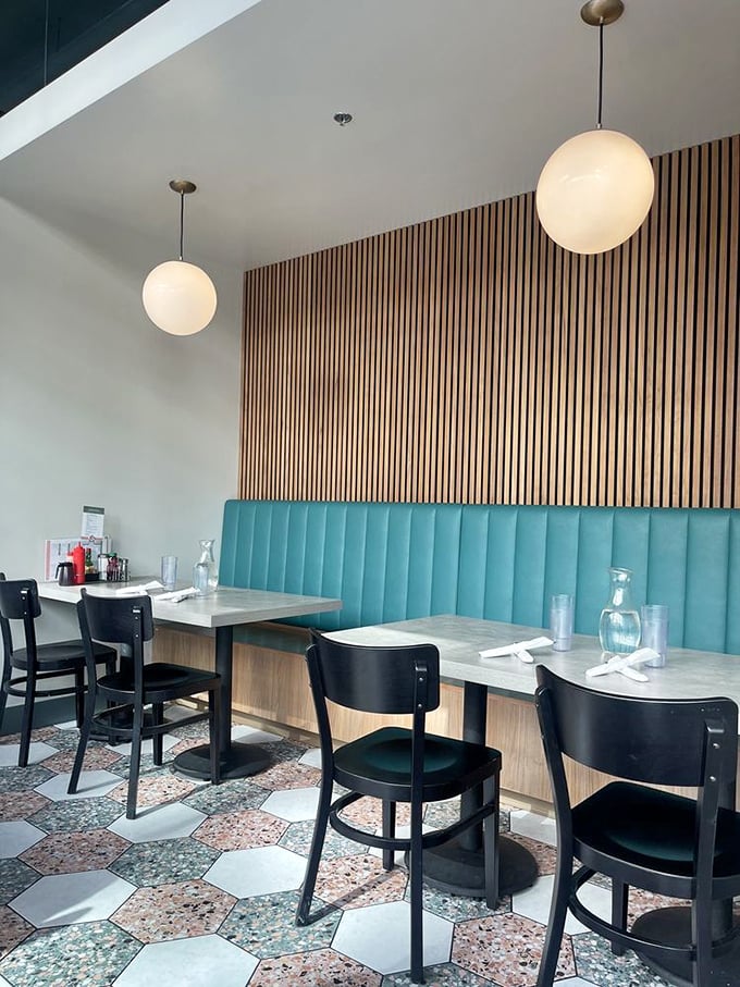 Mid-century meets modern comfort in Glo's interior. Those turquoise banquettes against wooden slats create the perfect backdrop for morning epiphanies over coffee.