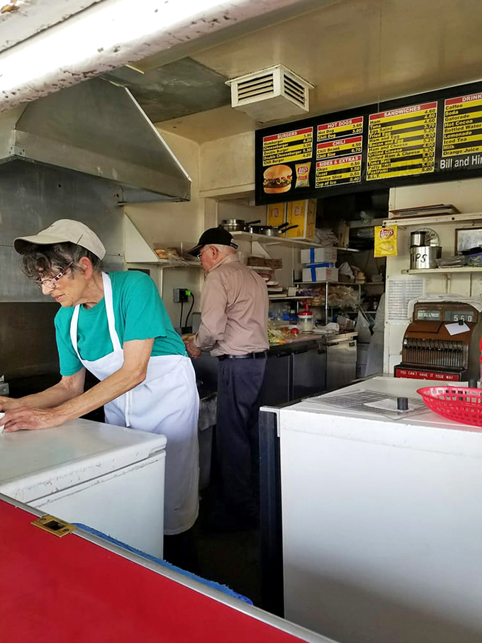 Where burger magic happens. The compact kitchen at Bill's is a symphony of efficiency, where decades of experience translate into edible perfection.