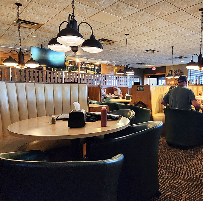 Cozy booths and warm lighting create that perfect "I'm about to eat something amazing" atmosphere that makes you want to settle in for the long haul.