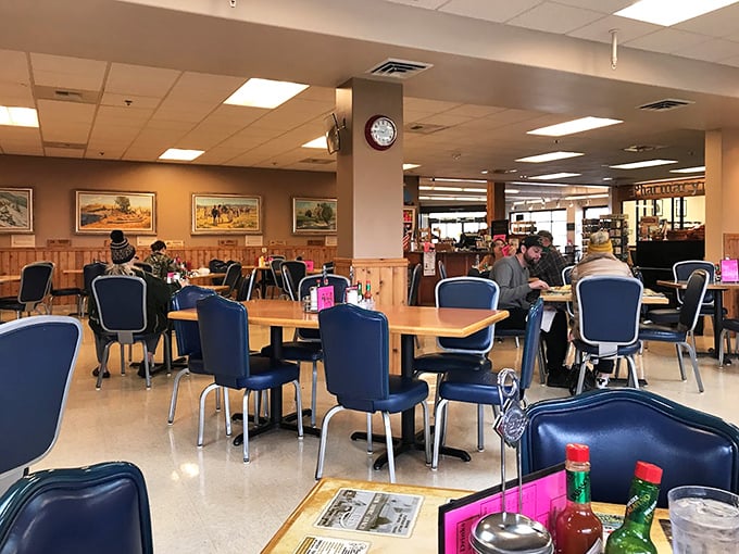 Where locals gather and stories unfold. The warm wood paneling and comfortable blue chairs invite you to settle in for a proper Montana breakfast experience.