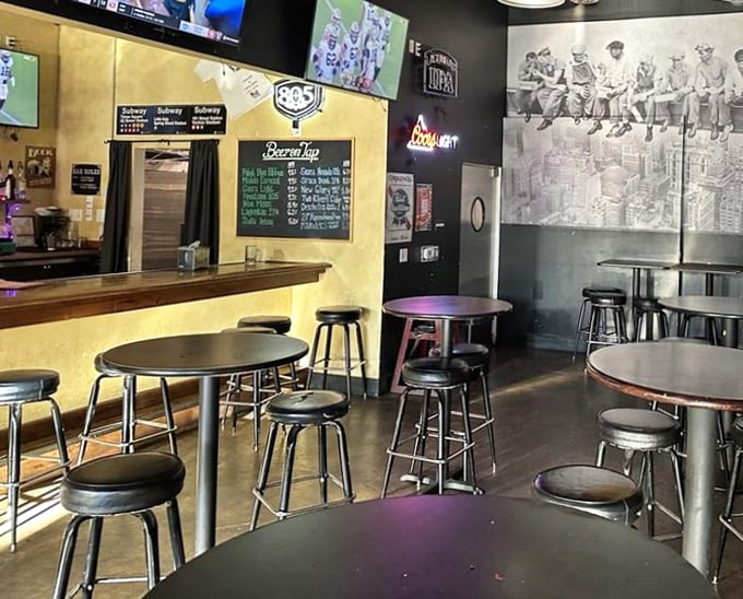 Inside, the iconic NYC skyline workers photo watches over diners as they contemplate life's most important question: one slice or two?