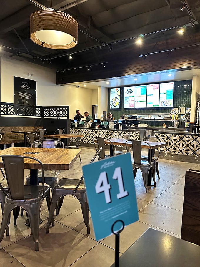 Modern meets traditional in Lolita's dining space. The patterned tile work whispers "authentic" while metal chairs say "stay awhile, but not forever."