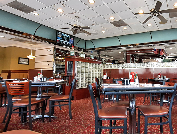 Step inside and you're transported to the classic diner experience &ndash; burgundy booths, glass block dividers, and ceiling fans that have witnessed countless coffee refills.