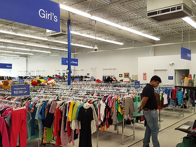 A sea of colorful garments stretches to the horizon, each rack a different chapter in the story of American fashion.
