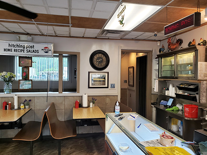 Inside, the wall clock, simple tables, and counter seating create that perfect neighborhood restaurant vibe that chain establishments spend millions trying to replicate.
