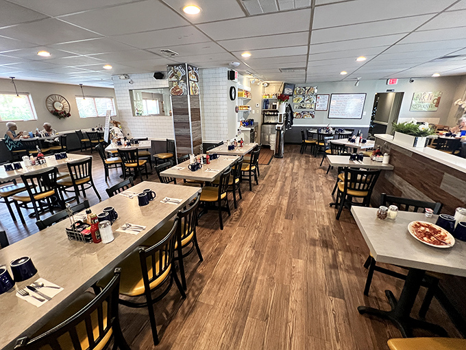 Inside, warm wood floors and comfortable seating create that perfect "everybody knows your name" atmosphere where breakfast dreams come true.