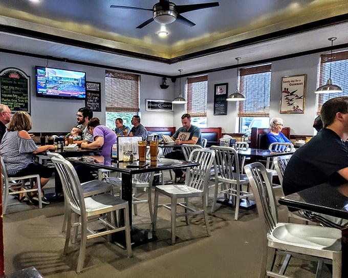 Inside, the cozy dining room buzzes with conversation as diners eagerly await their next cheese-pull moment. College memories are made here.