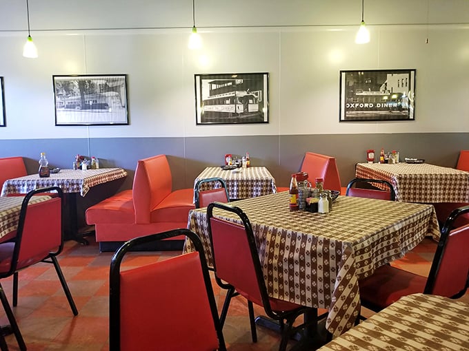 Classic red vinyl booths and checkered tablecloths create that timeless diner atmosphere where conversations flow as freely as the coffee refills.