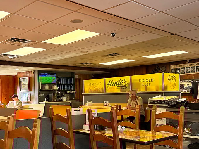 Inside Hyde's, time stands wonderfully still with wood-paneled walls and yellow signage announcing life's essentials: "Breakfast," "Hyde's," and the magic words "Dinner & Pie."