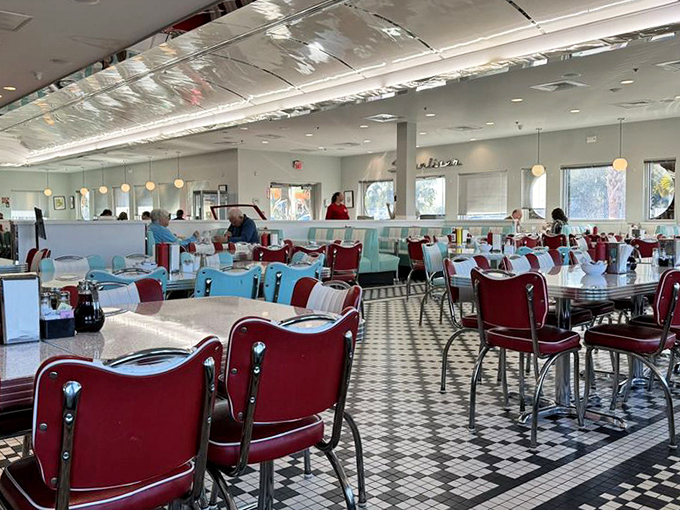 Red vinyl meets turquoise accents in this checkerboard paradise where calories don't count and conversations flow as freely as the coffee.