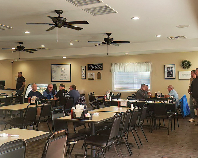Inside, ceiling fans lazily spin above a gathering of regulars who've turned this diner into their second living room. The breakfast club meets daily, solving world problems over coffee.