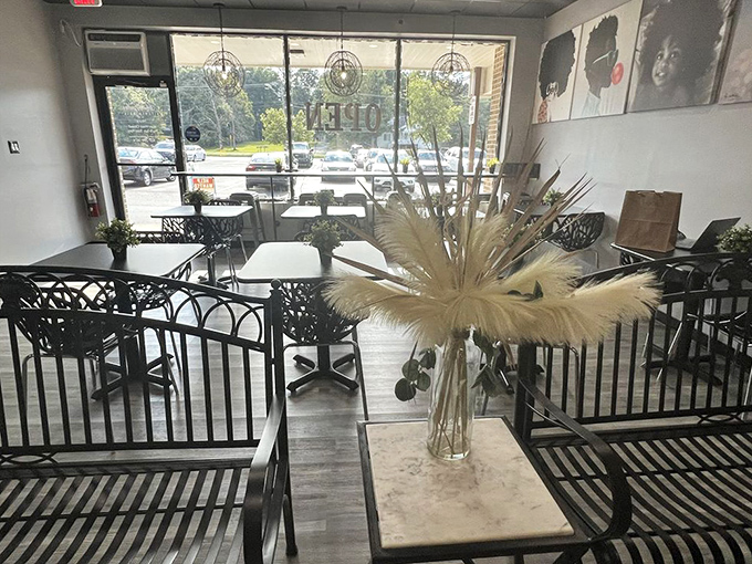 Sleek black chairs and dried pampas grass centerpieces create an atmosphere that's both modern and welcoming&mdash;soul food with style.