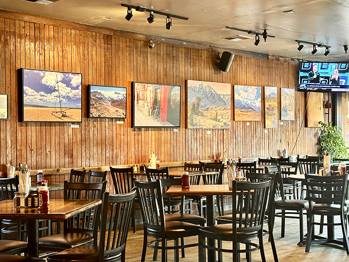 Warm wooden paneling and local artwork create that rare atmosphere where you instantly feel like a regular, even on your first visit.