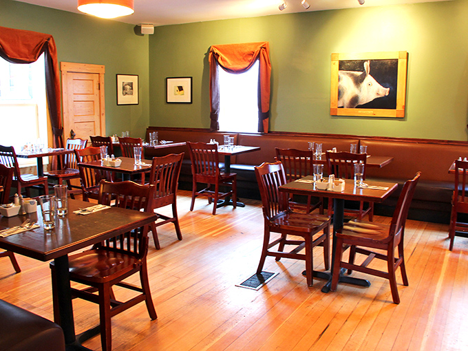 Where sage green walls meet warm wood tones, creating the perfect backdrop for breakfast conversations that linger longer than your coffee.