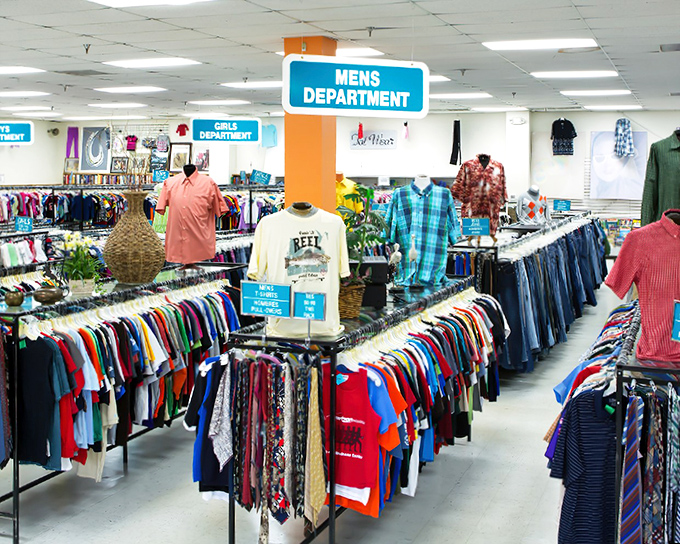 Color-coded organization that would make Marie Kondo weep with joy. The men's department stretches into the horizon like a rainbow of second-hand possibilities.