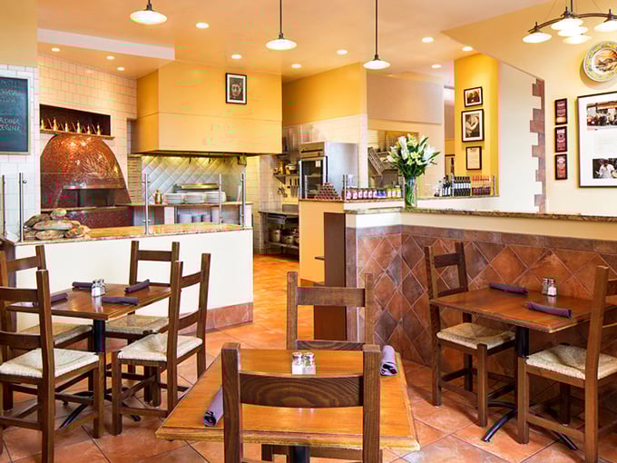 Where pizza dreams come true &ndash; the warm, inviting interior combines rustic charm with that magnificent wood-burning oven, the beating heart of any true pizzeria.