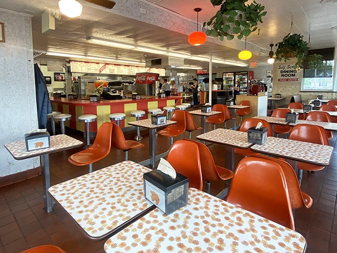 Orange chairs that haven't changed since the moon landing paired with those unmistakable daisy-patterned tables&mdash;a time capsule worth visiting.