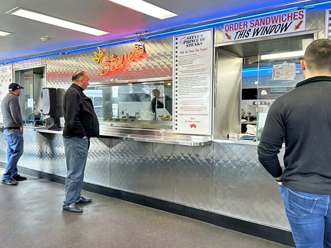 The ordering counter&mdash;where Philly's sacred ritual begins. Notice the neon glow illuminating what might be the most important decision of your day.