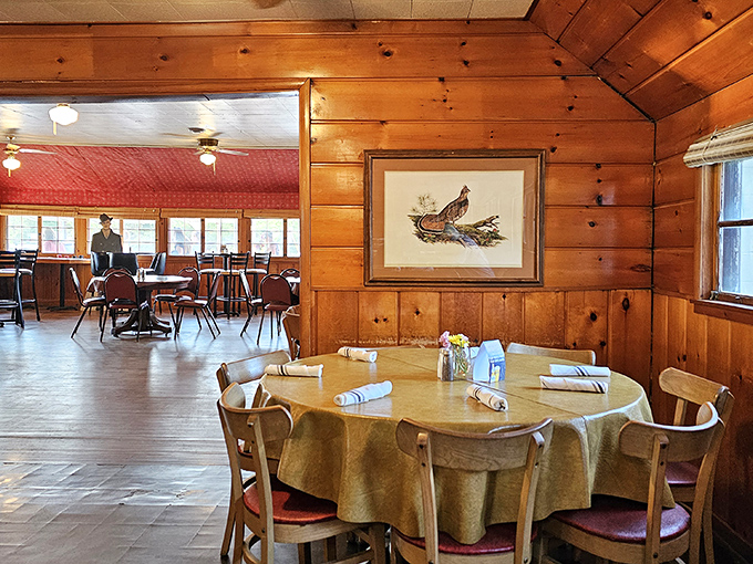 Knotty pine walls and simple tablecloths create that authentic "up north" feeling&mdash;no interior designer needed, just decades of lakeside memories.