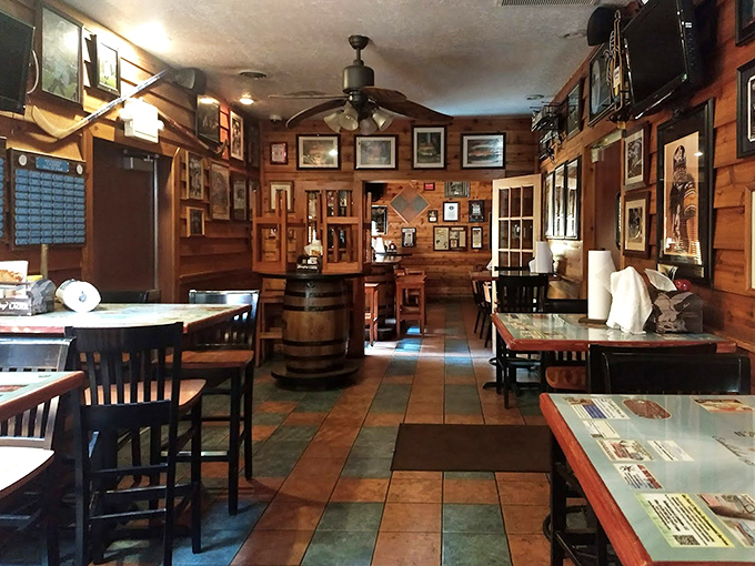 Wood-paneled walls tell stories of eating conquests past, while barrel tables await the next brave soul ready for burger battle.
