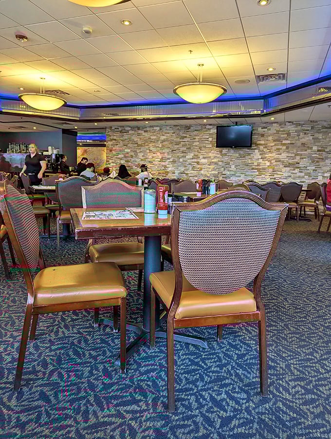 Inside, the stone accent wall and comfortable seating create that perfect balance of modern touches with classic diner coziness.