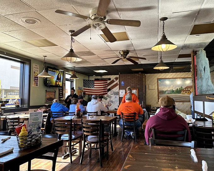 Where ceiling fans spin stories and American flags hang with pride. This isn't just dining—it's a community gathering where seafood brings strangers together.