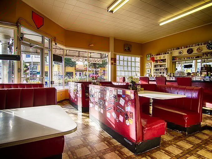 Red vinyl booths that have cradled generations of breakfast lovers, where conversations flow as freely as the coffee.