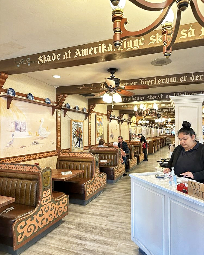 Danish proverbs adorn wooden beams above cozy booths where countless happy diners have discovered the simple joy of authentic Scandinavian comfort food.