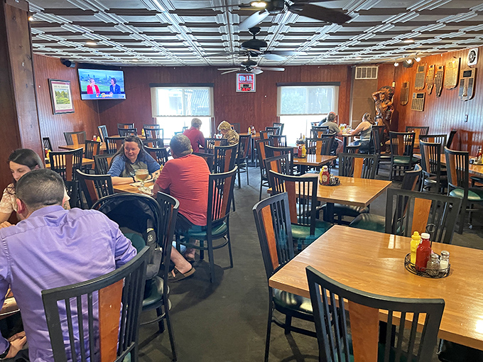 Inside, wood paneling and comfortable seating create the perfect backdrop for the food drama about to unfold on your plate.