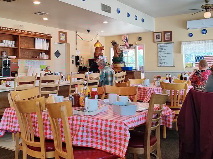 Checkered tablecloths and Viking decor create the kind of cozy atmosphere where strangers become friends over coffee.