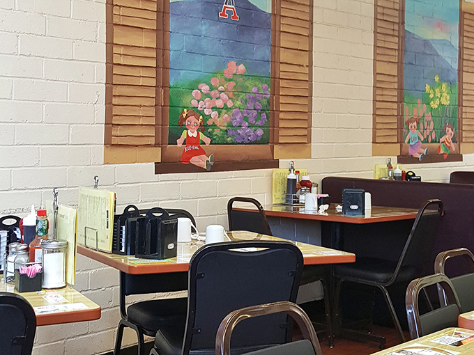 Inside, whimsical painted scenes adorn the walls above no-nonsense tables where serious breakfast business happens daily.