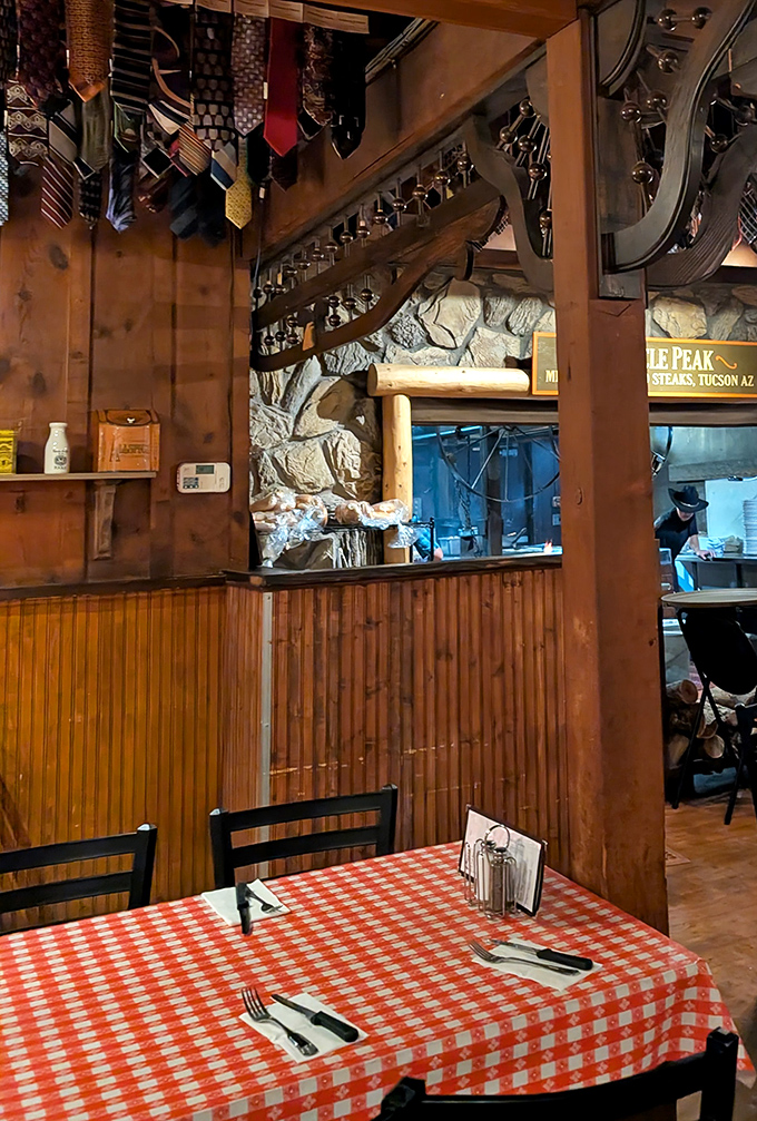 Those neckties dangling from the ceiling? Each one tells a story of a city slicker who didn't read the "casual dress" memo.