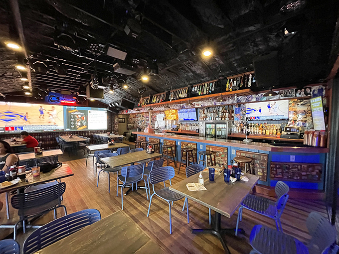 Inside, the bar stretches like a runway of good times, with enough TVs to satisfy every sports fan's wildest dreams.