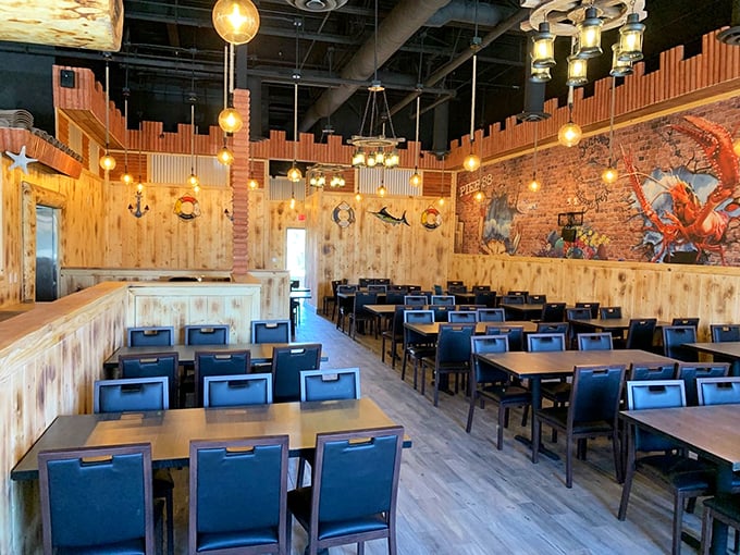 Maritime magic meets modern comfort &ndash; where wooden walls and blue chairs create the perfect backdrop for shellfish shenanigans.
