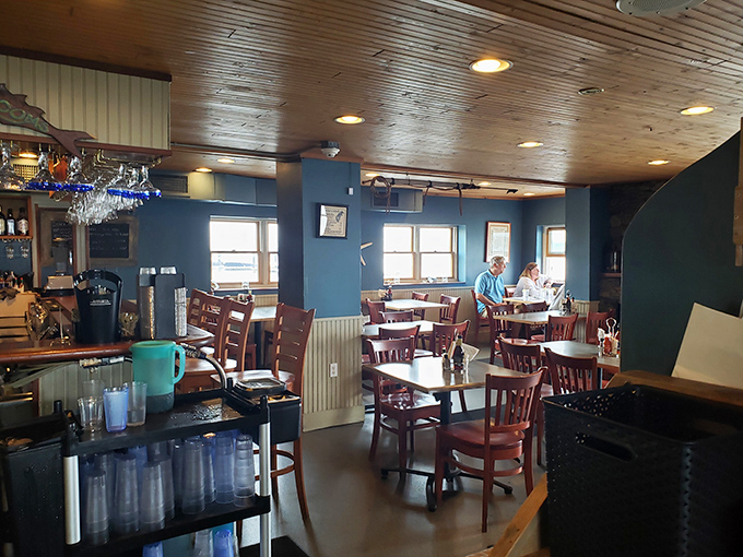 Blue walls, wooden ceiling, and the gentle hum of satisfied diners create the perfect New England seafood sanctuary.