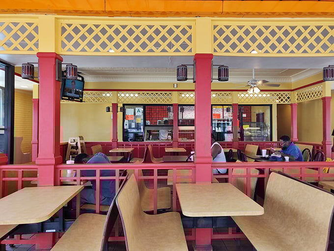 Those bright pink pillars aren't trying to impress anyone &ndash; they're too busy holding up fried chicken greatness.