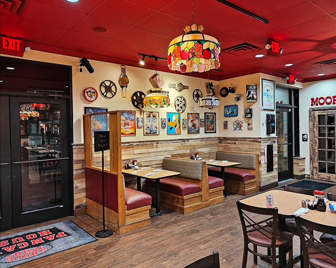 That red ceiling isn't just decor &ndash; it's a warm embrace that makes every booth feel like your personal breakfast sanctuary.